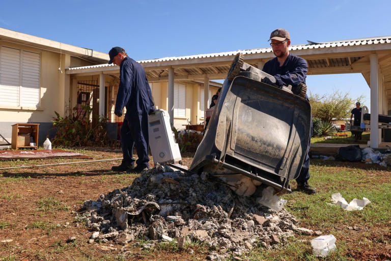 Hurricane Melissa: 39 pictures of helpful Royal Navy sailors repairing ...