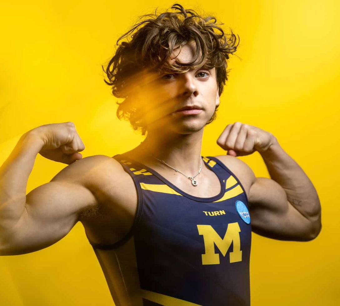 Gay Michigan gymnast hard-launches relationship with his cheerleader ...