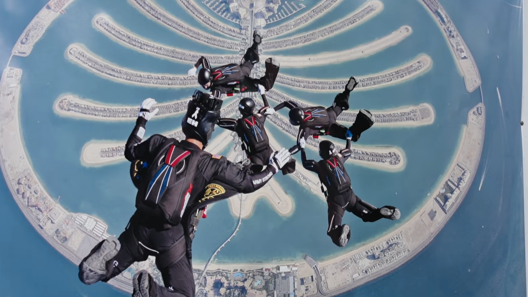 Watch America’s Elite Parachute Team Drop Into a Stadium From 13,000 Feet