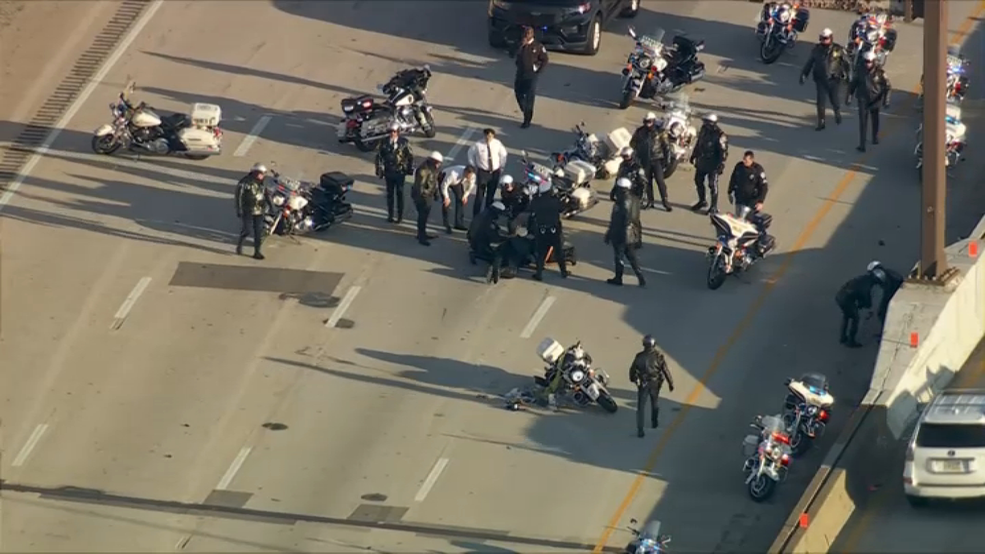 Live: Police motorcyclist wipes out on I-95 in procession to Camp Out ...