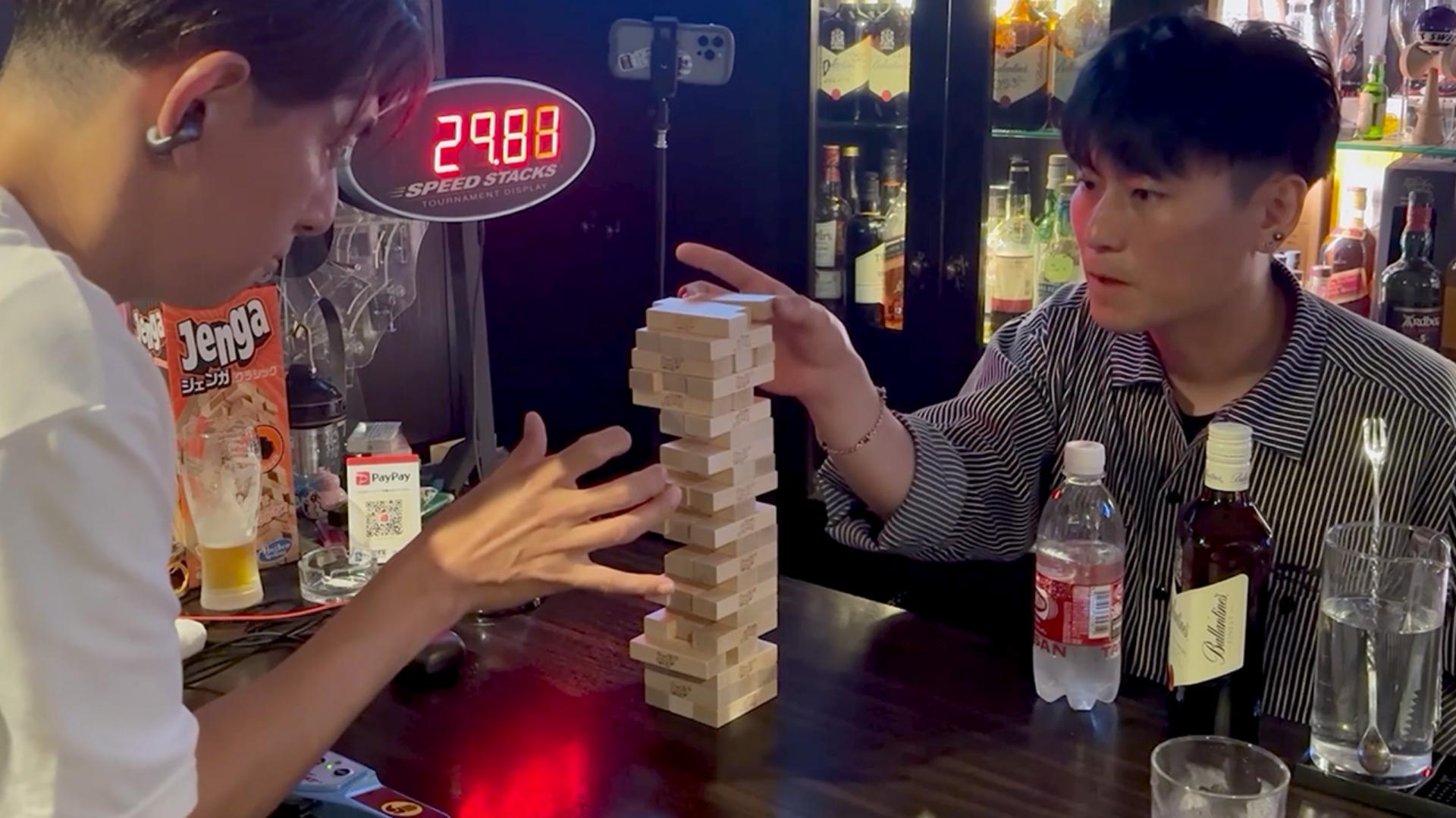 Most Jenga blocks removed in one minute (team of two) - 23 by NAOKI and ...