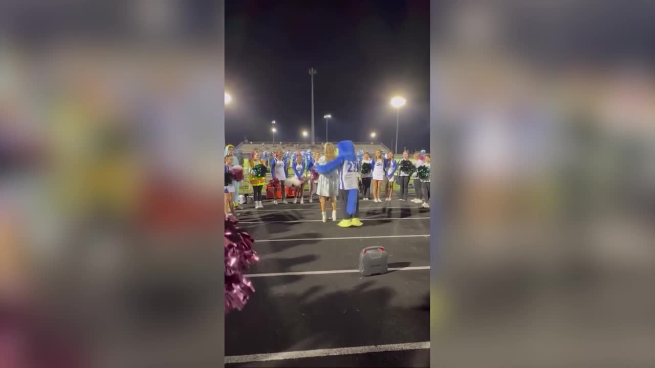 Cheer coach says 'yes' on the sideline