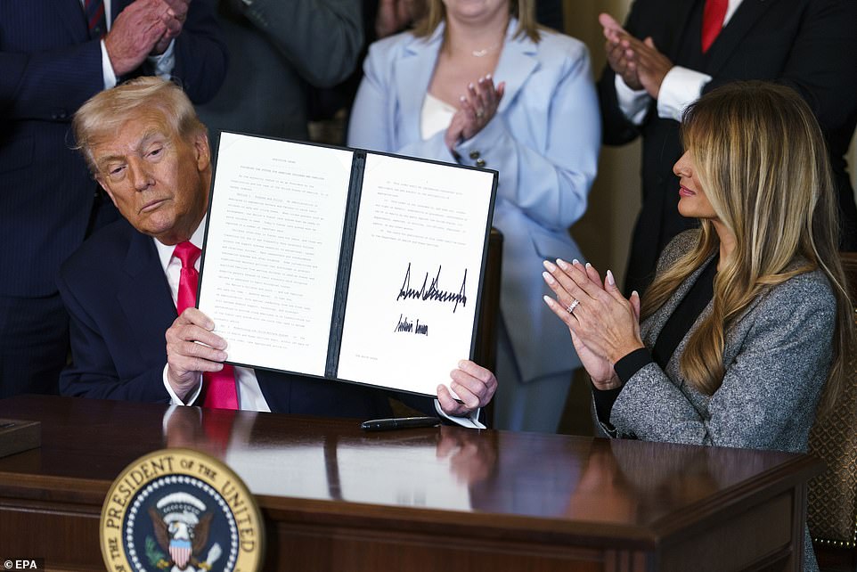 Melania signs executive order alongside Trump