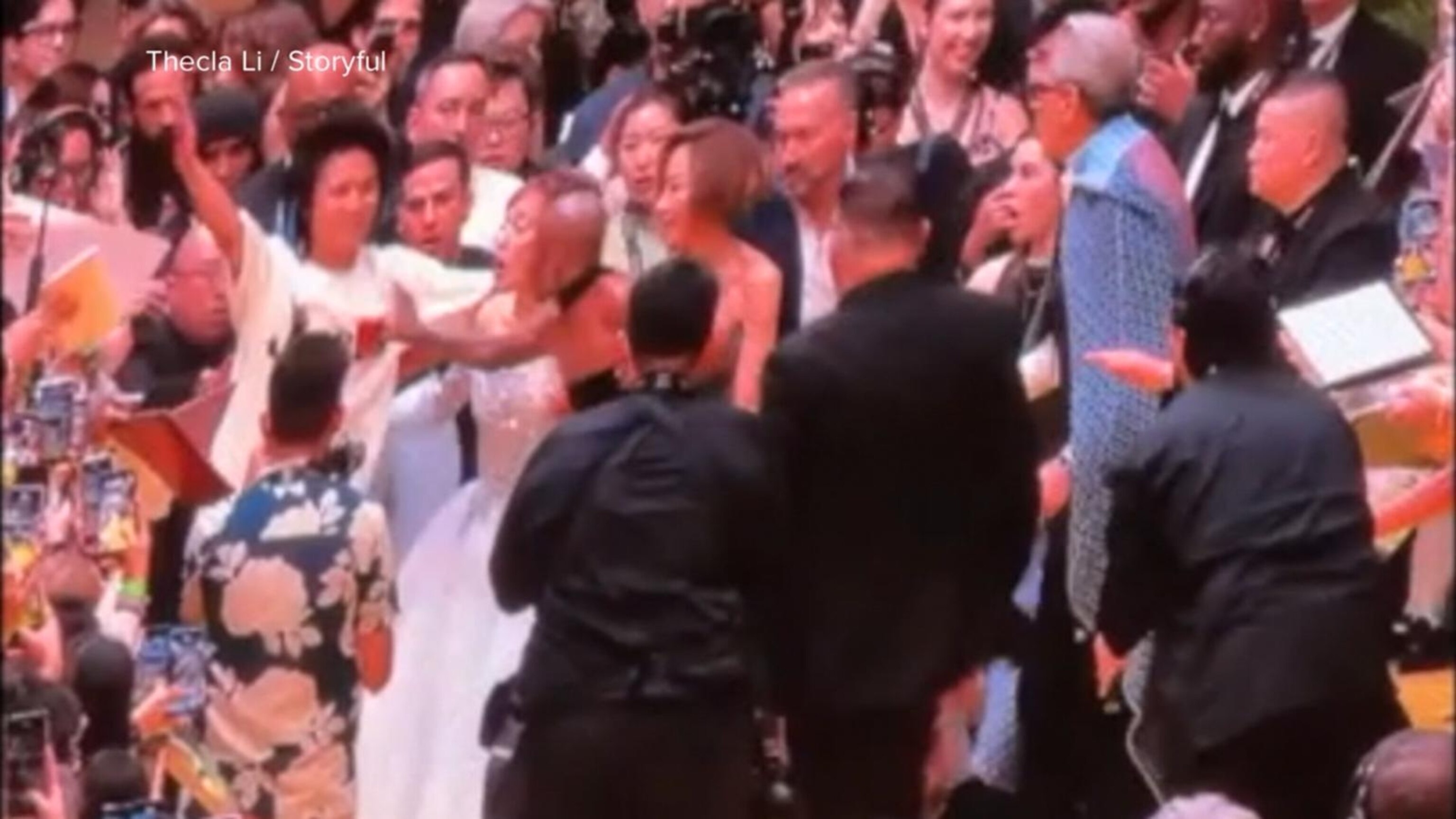 Ariana Grande rushed by man at "Wicked: For Good" Singapore premiere