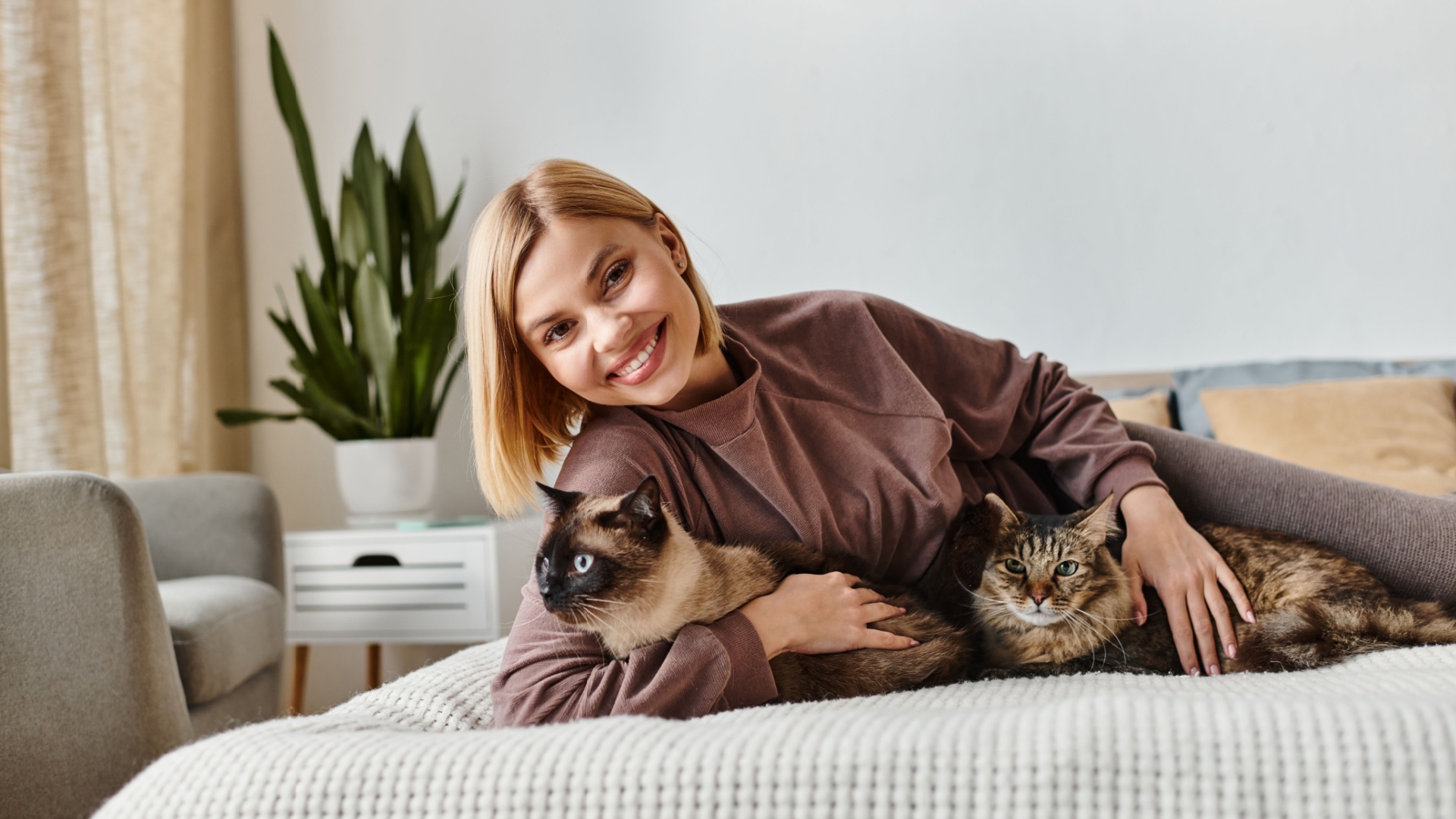 6 Reasons Some People Attract Cats Like Magnets