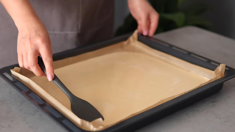 The Only Way To Perfectly Line A Baking Sheet With Parchment Paper ...