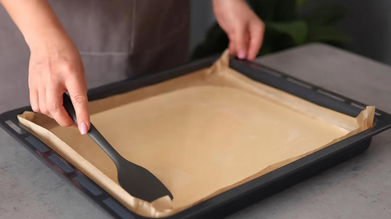 The Only Way To Perfectly Line A Baking Sheet With Parchment Paper ...