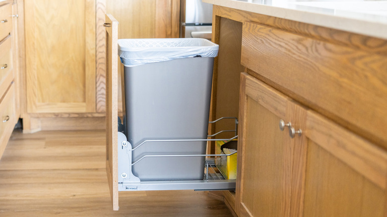 Prevent The Kitchen Trash Cabinet From Getting Banged Up With An Easy DIY