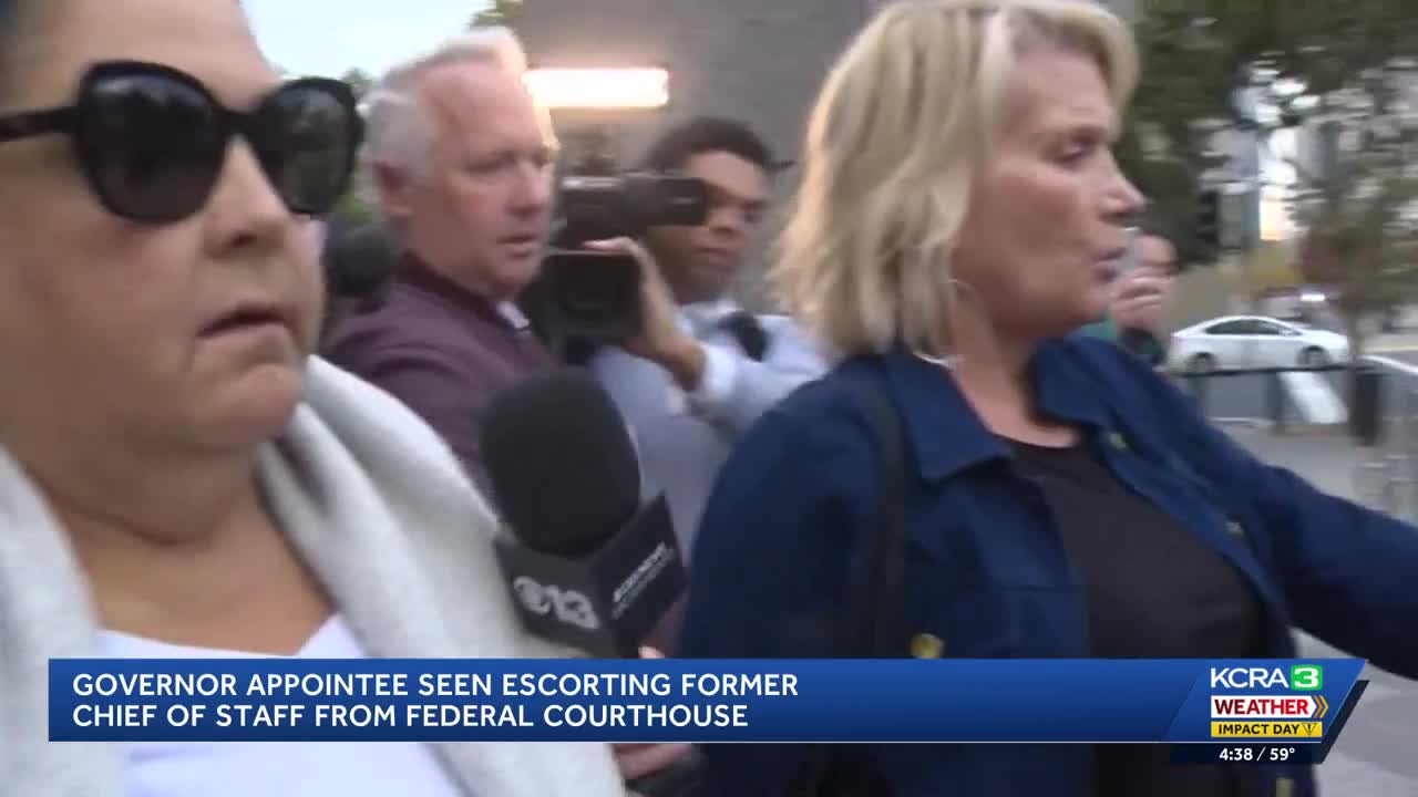 Governor appointee seen escorting former chief of staff from federal ...