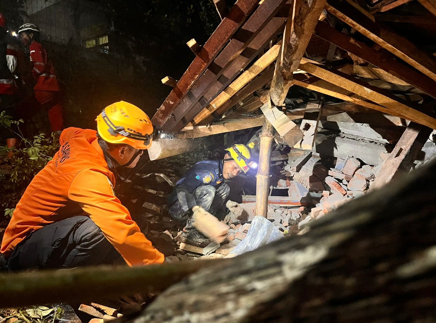 Landslides in Indonesia's Java island leave 2 dead and 21 missing