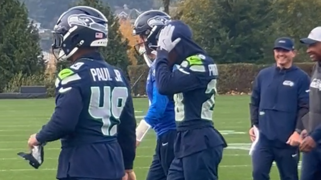 Coaches Mike Macdonald, Leslie Frazier joke with Nehemiah Pritchett (28 ...