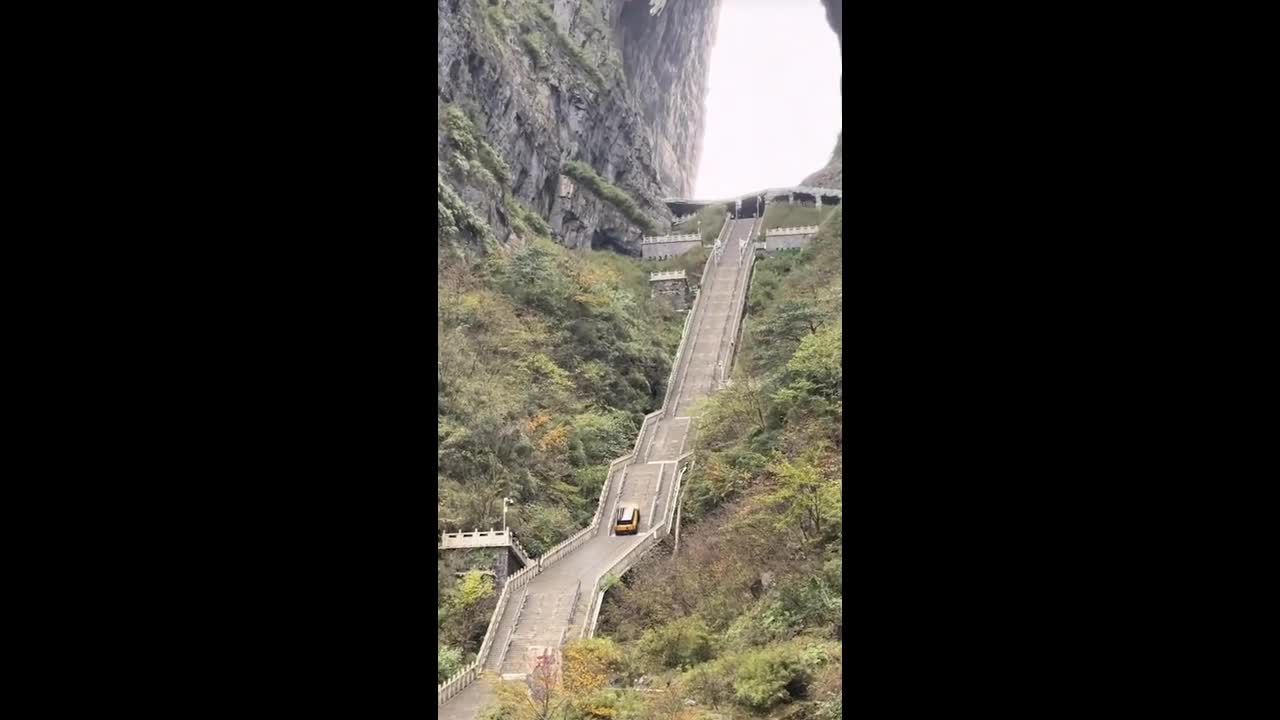 Electric car slides down iconic Tianmen Mountain steps crashing into ...