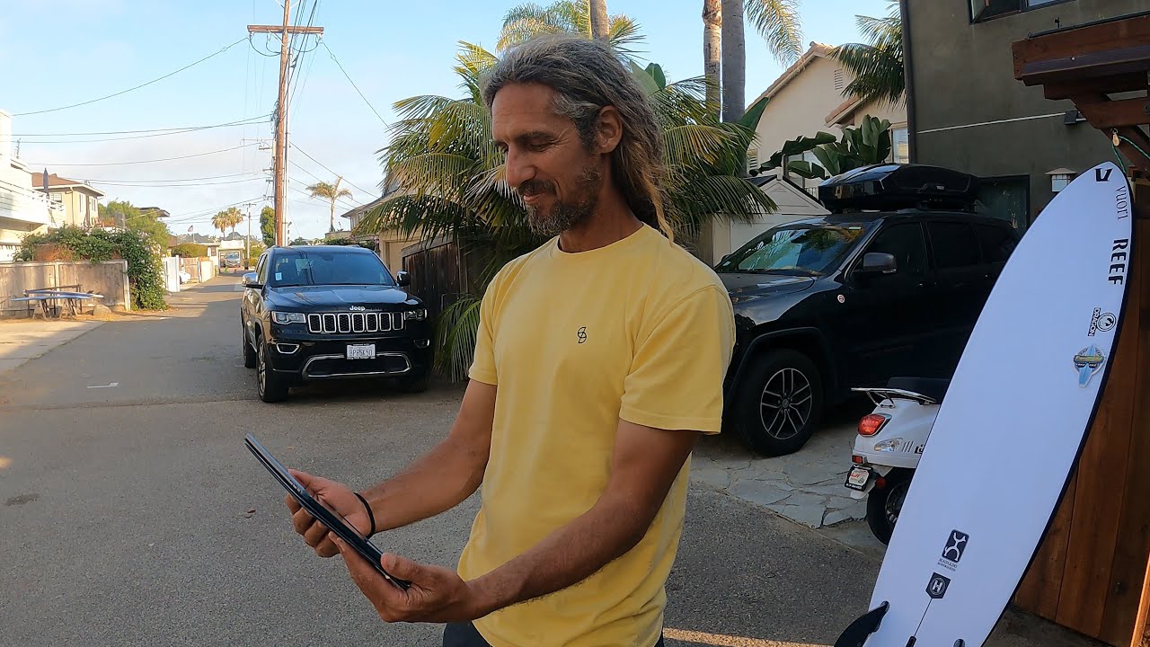 Rob Machado watches blind surfer ride his Sunday board