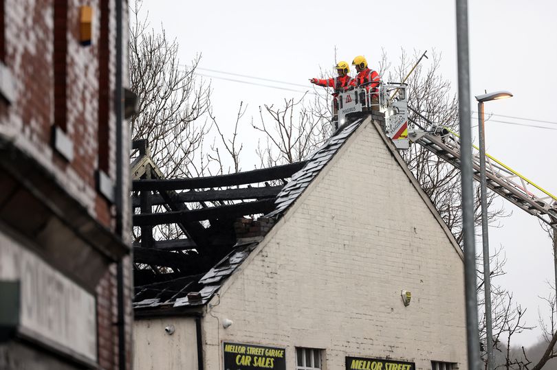 Residents 'hear bangs' at 3am as huge fire tears through garage leaving ...
