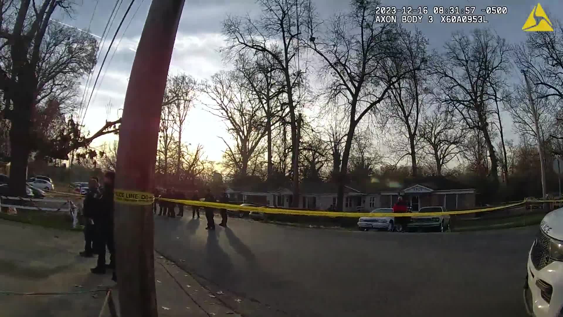 Police watch as Sanrico McGill's family grieves