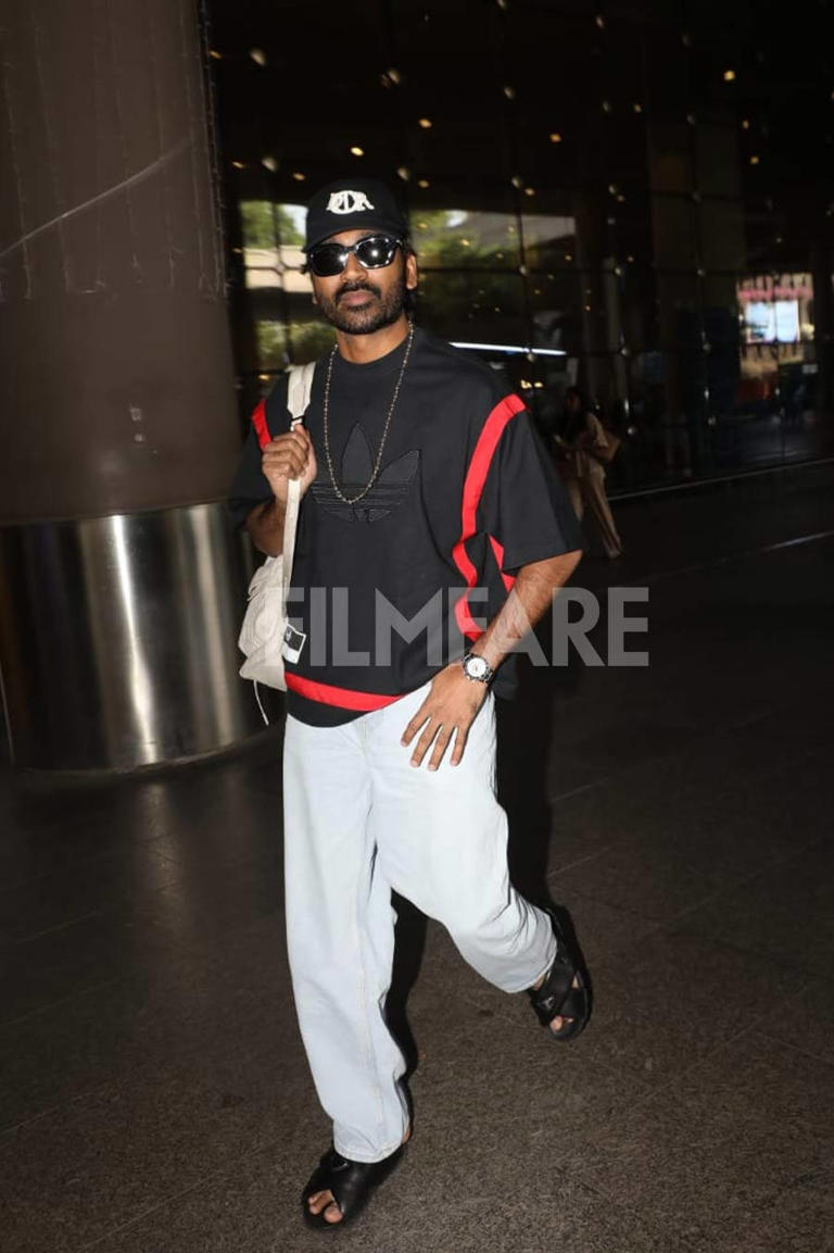 Photos: Dhanush Keeps It Stylish at The Airport