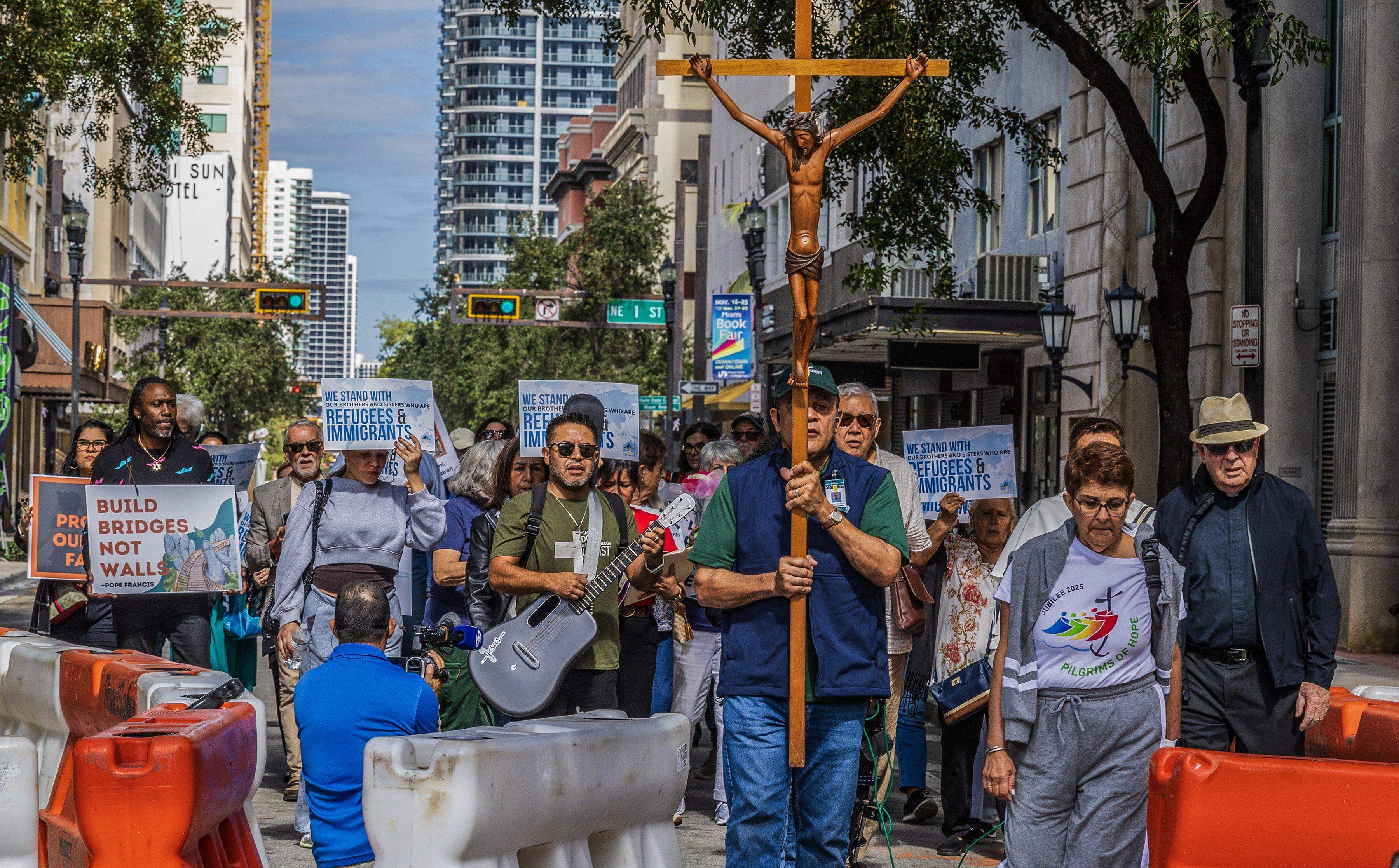In honor of a patron saint, Catholic groups pray, protest outside Miami ...