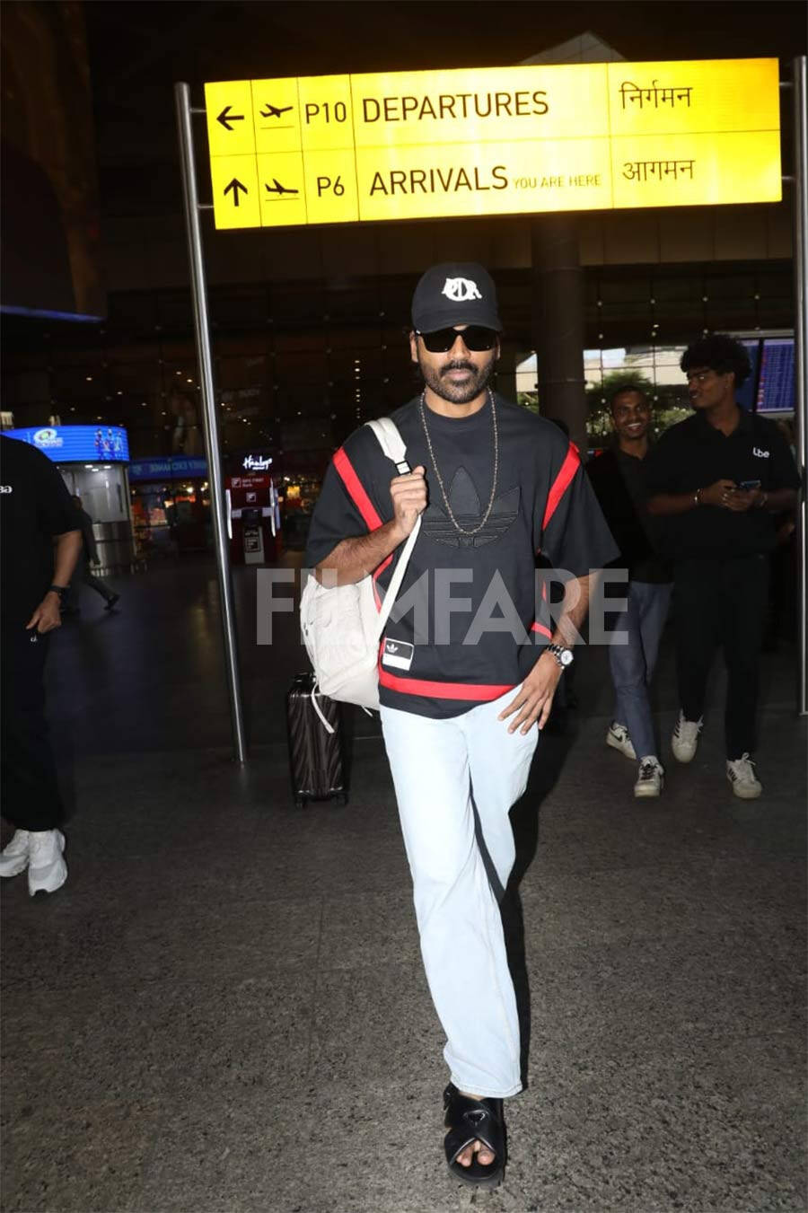 Photos: Dhanush Keeps It Stylish at The Airport