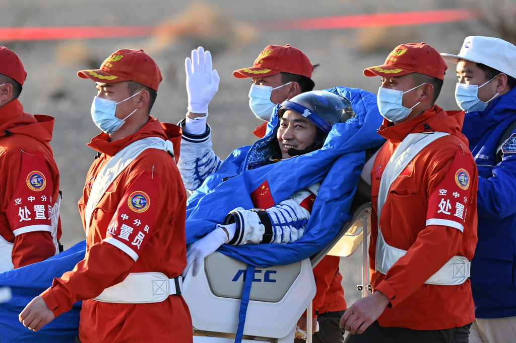 Chinese astronauts return from space station after delay blamed on ...
