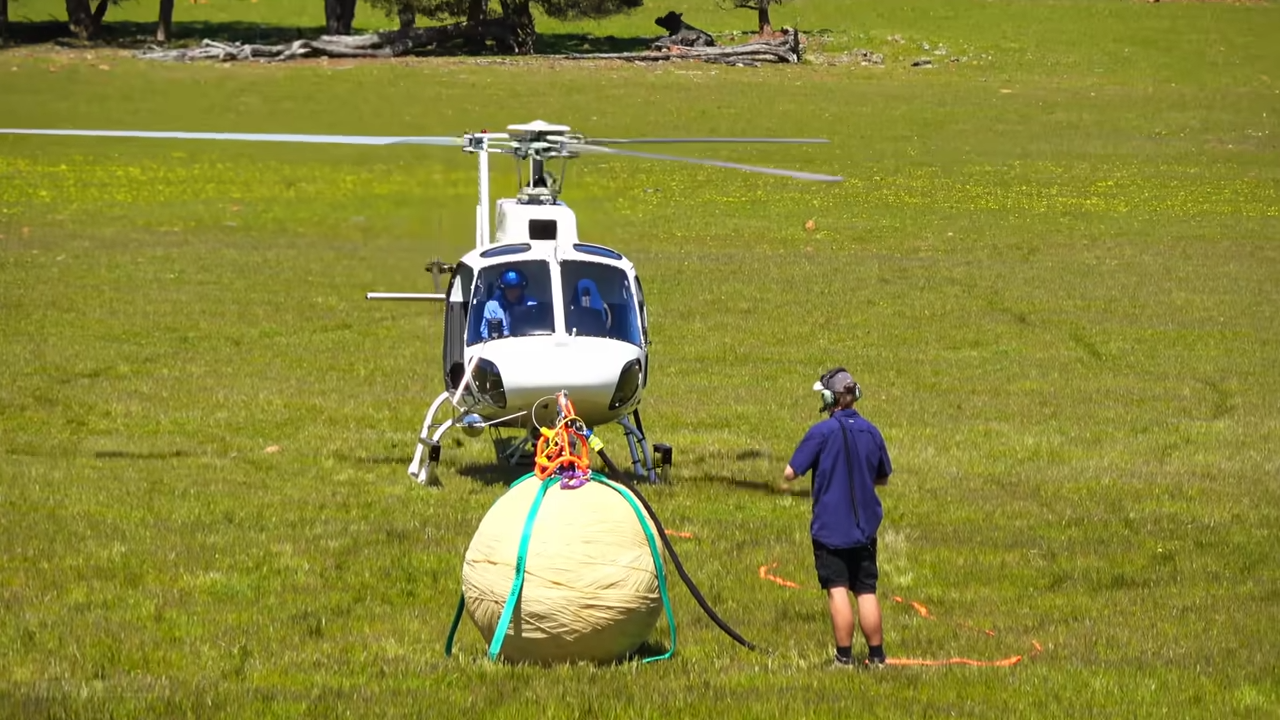 What happens when a 1 ton rubber band ball hits the ground