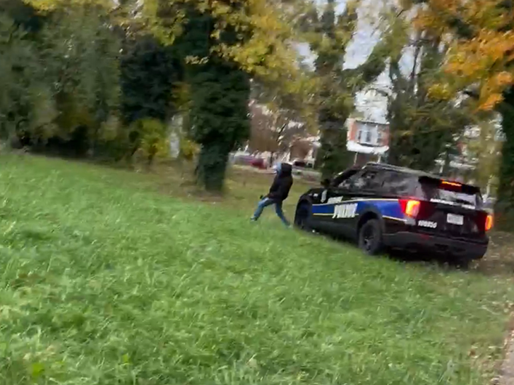 Baltimore Police SUV Nearly Runs Man Down on Street on Video, Cop Arrested