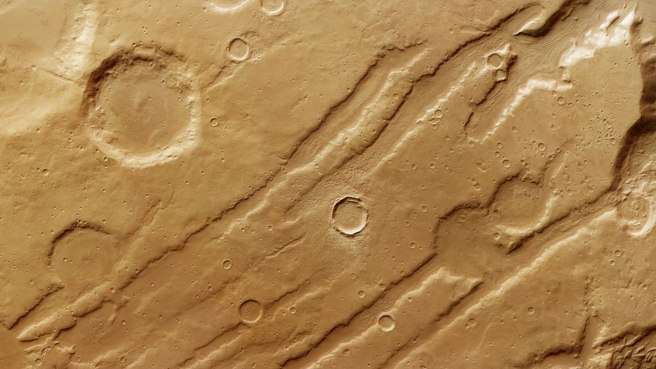 Deep 'scratches' and craters on Mars tell the tale of a Red Planet ice age
