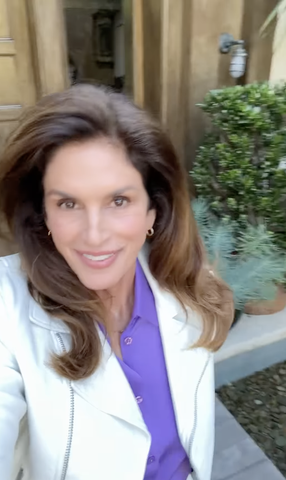 Cindy Crawford Steps Out in Purple Button Up and Jeans for an ...