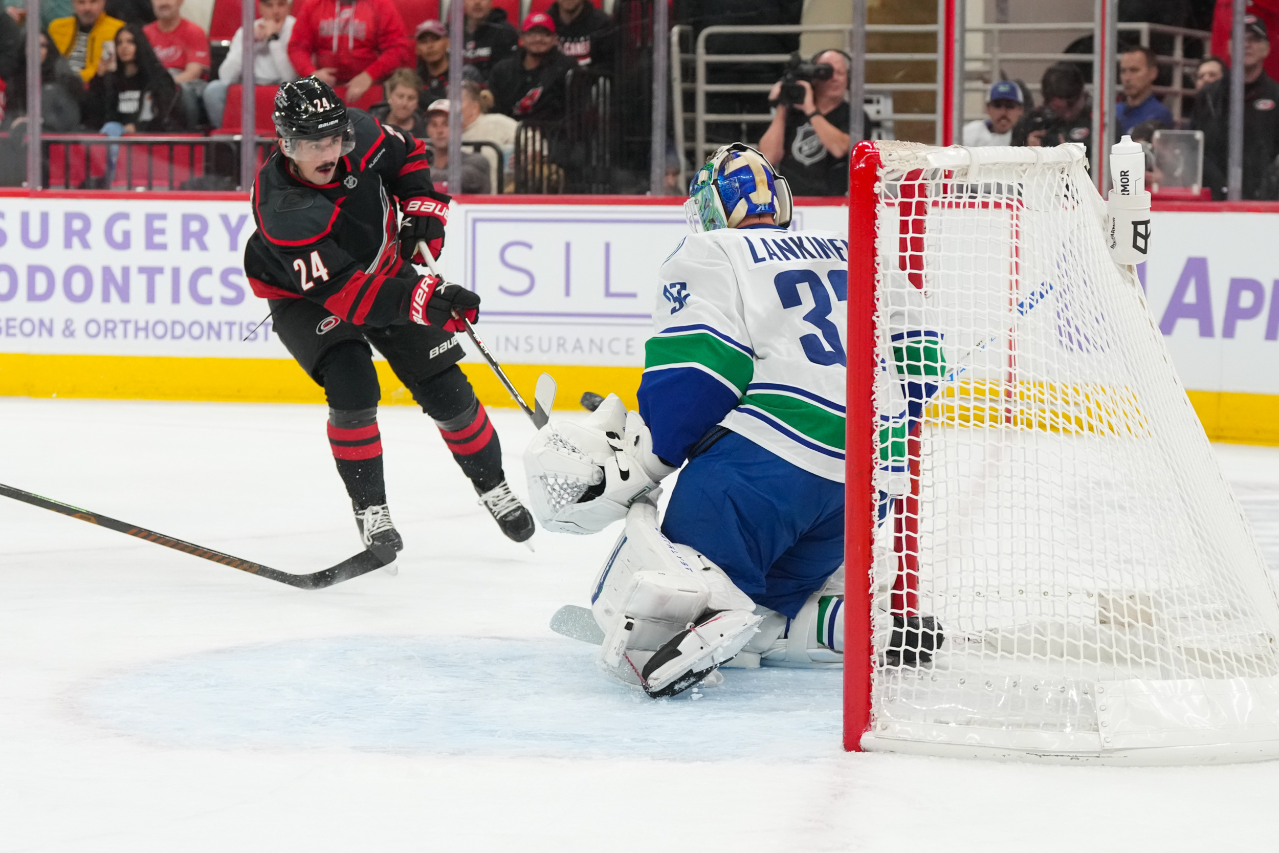 Canucks hang on for 60 minutes, but fall to Hurricanes in OT 4-3
