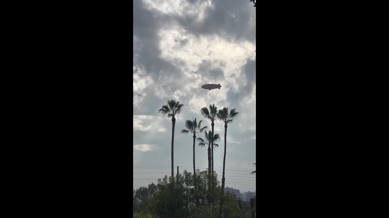 A striking Marty Supreme branded blimp glides above West Hollywood