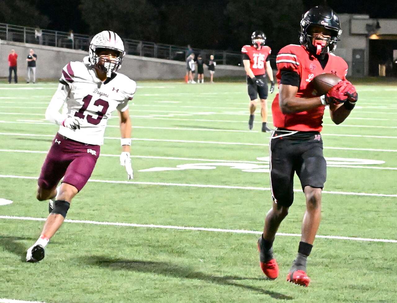 Lake Travis' pass game blows past Round Rock in 41-14 bi-district win