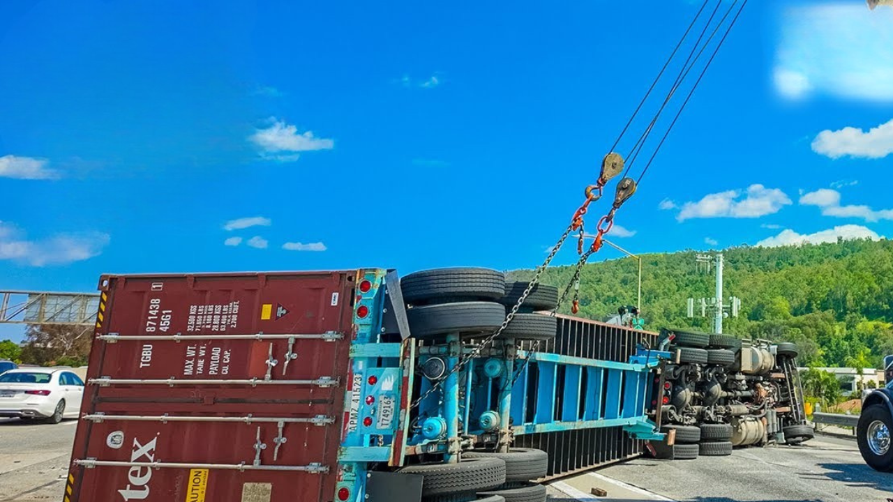 Another container rollover blocking freeway lanes