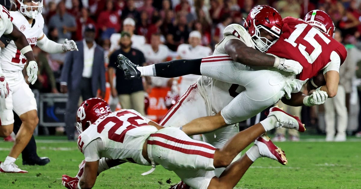 Alabama staffer clears Oklahoma players off attempting to take pictures ...