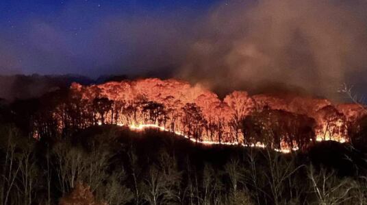 Crews continue to battle forest fire
