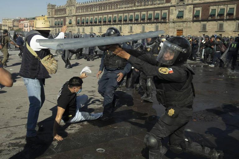 Clashes erupt in Mexico City anti-crime protests, injuring 120