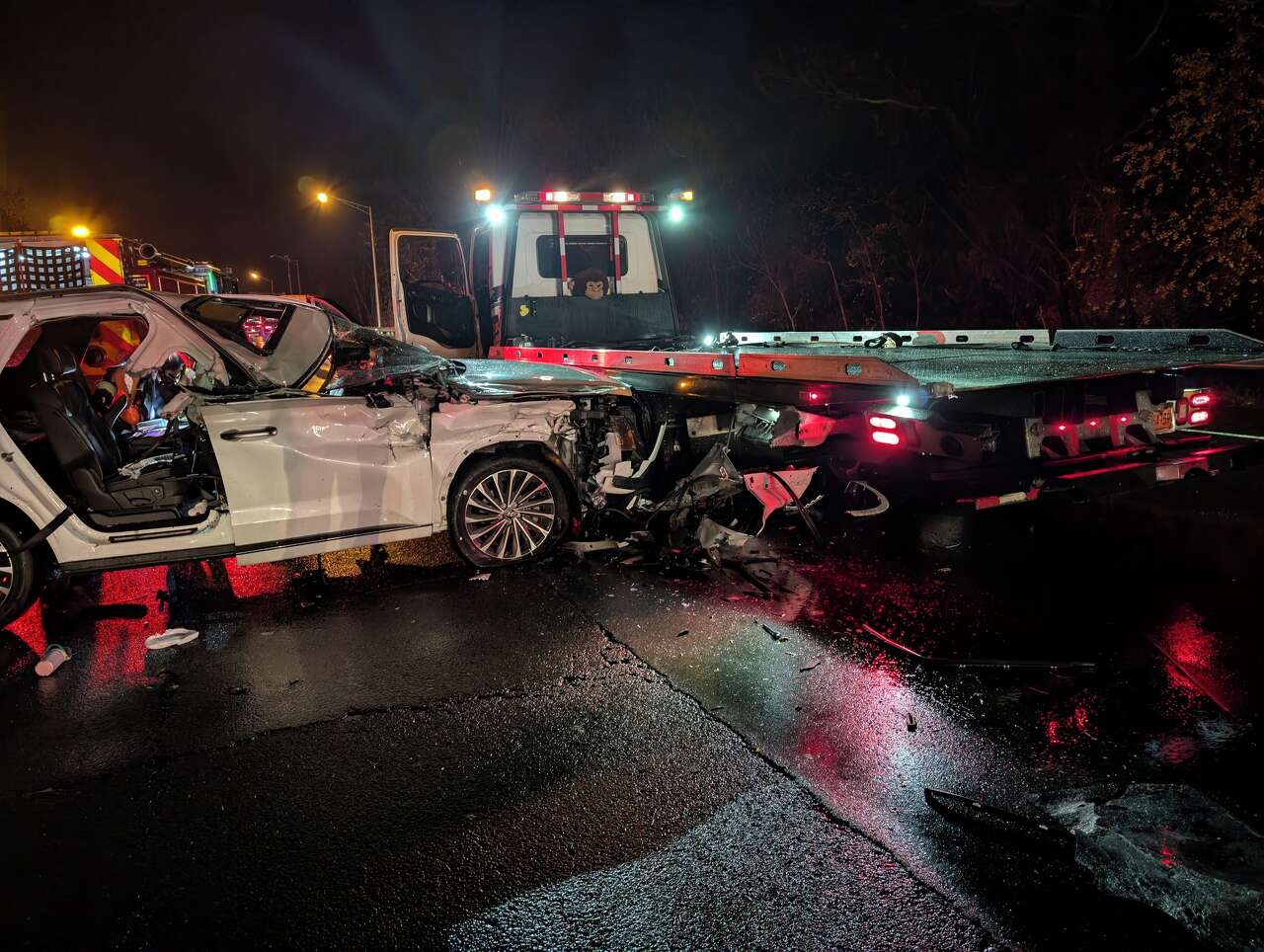Tow truck at crash scene struck by SUV in Westport Sunday, officials say
