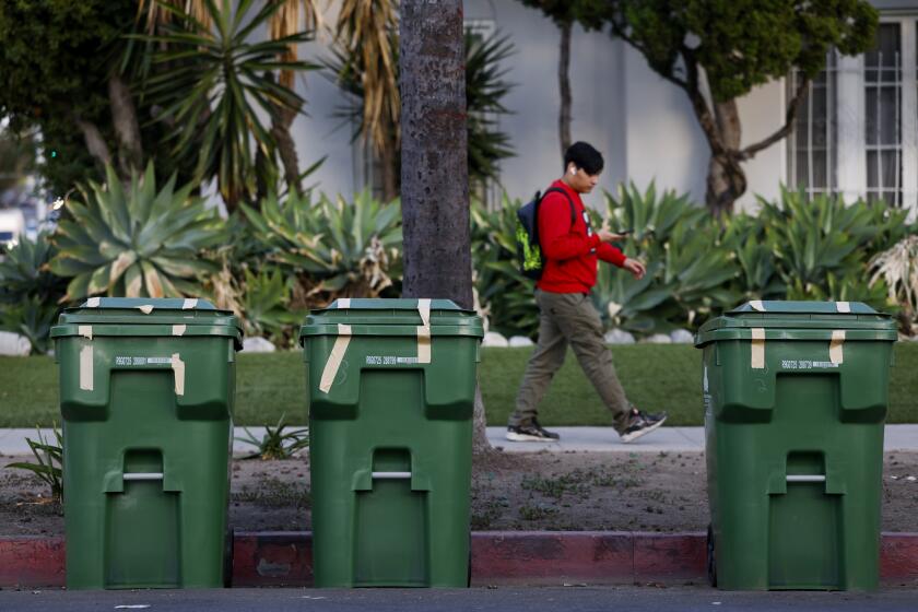 Green bins clog L.A. curbs as city's organic waste program goes into ...