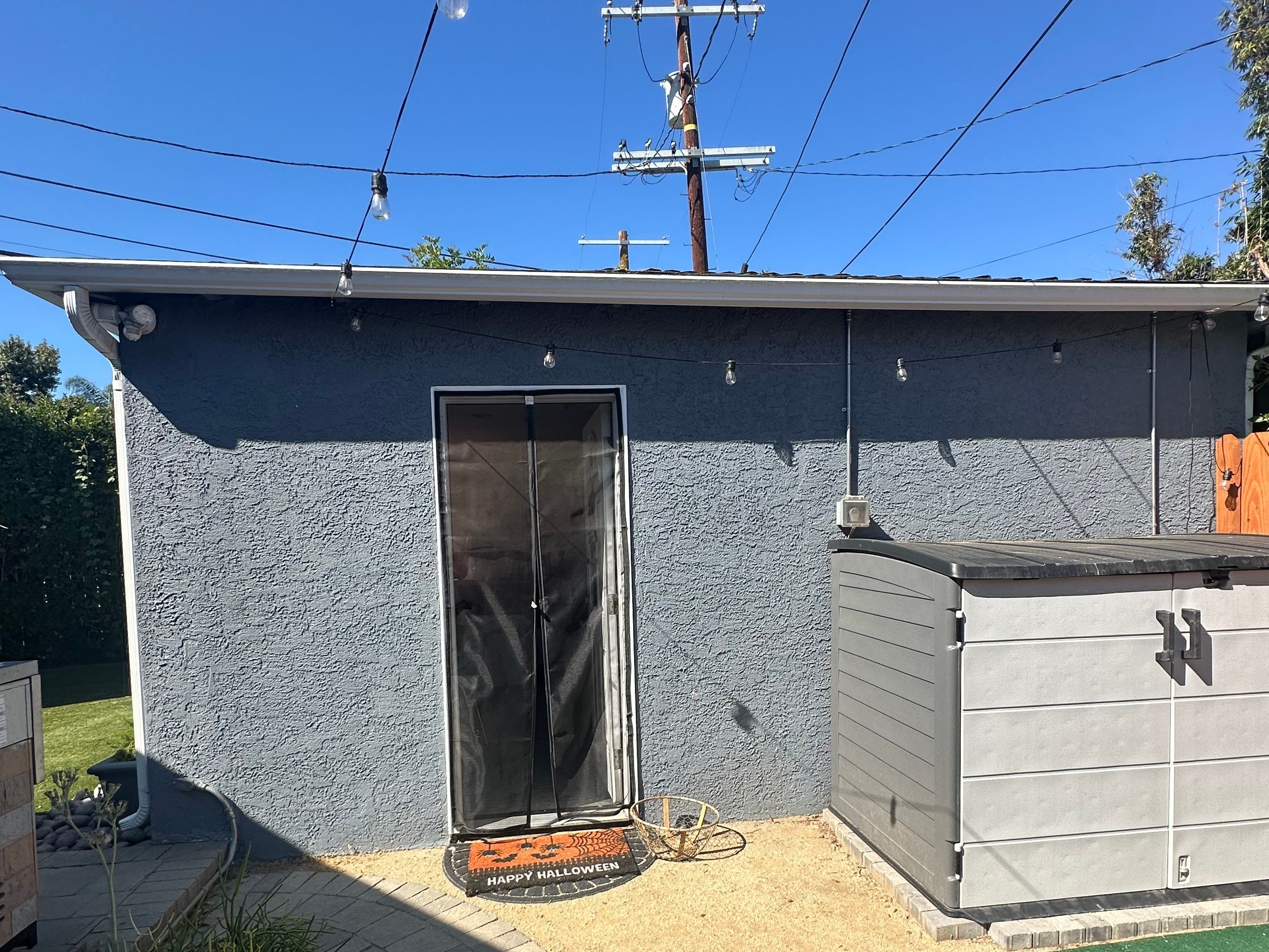 I live in a pool house in a stranger's backyard. The tiny house is ...