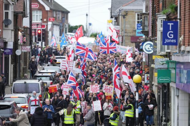 Hundreds turn out for protest against plans for migrant camp at army base