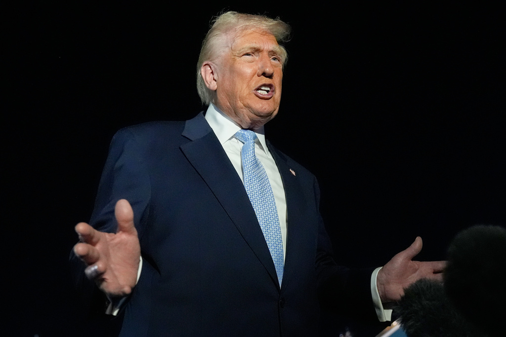 Trump defends Tucker Carlson after interview with activist known for ...