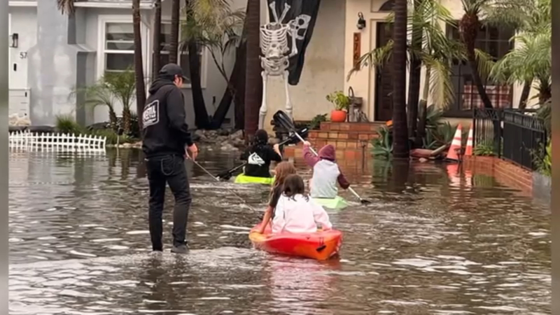 Long Beach residents kayak on flooded streets