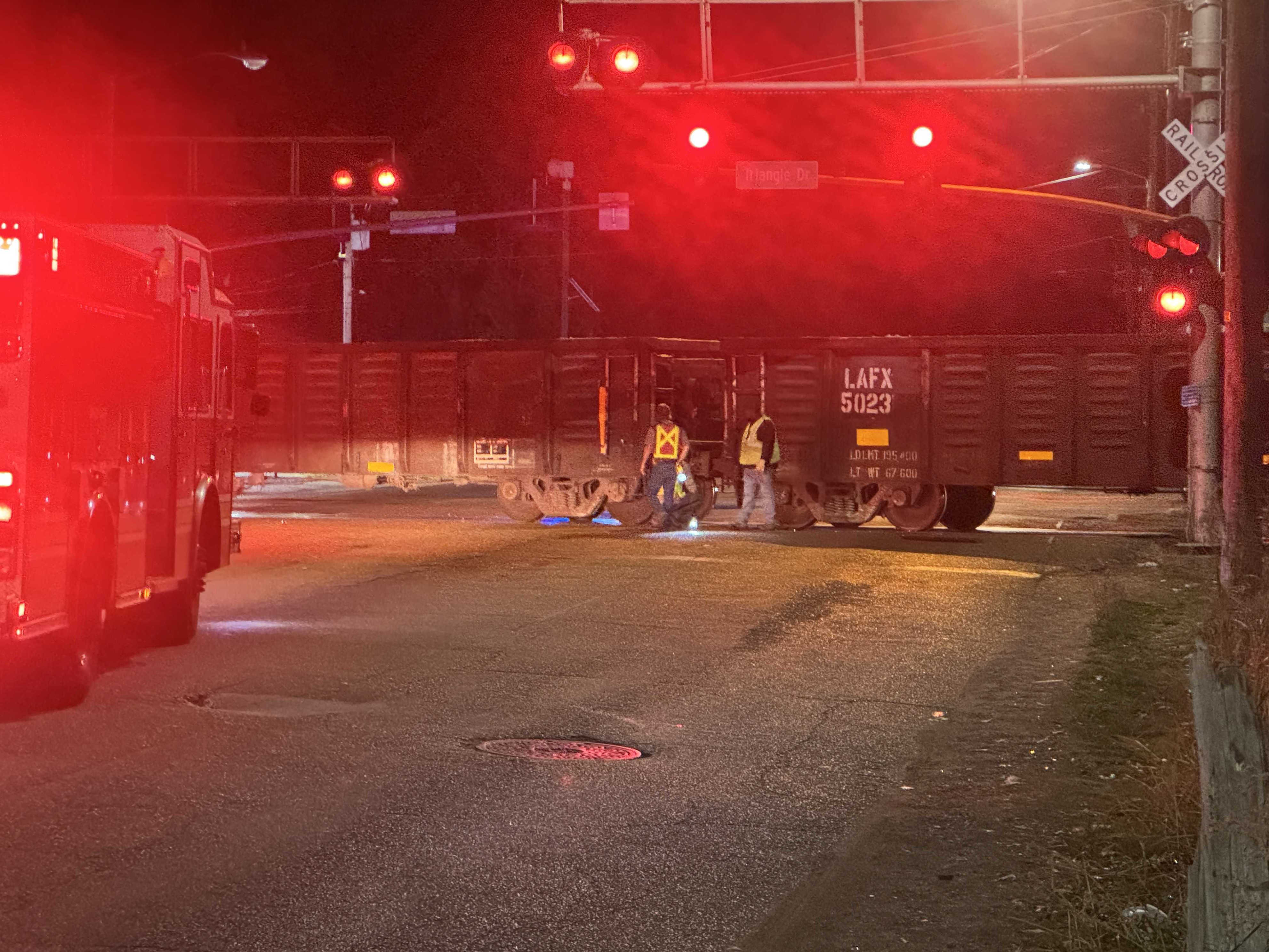 Police respond to a train collision involving a vehicle