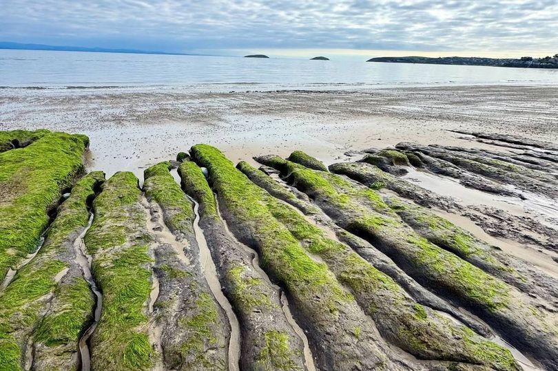 Storms reveal eerie 'ghost' formations and mystery wreck on Welsh beach