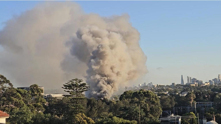 Bakery up in flames near busy train station