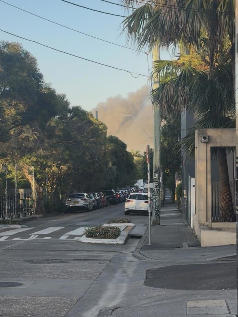 Bakery up in flames near busy train station