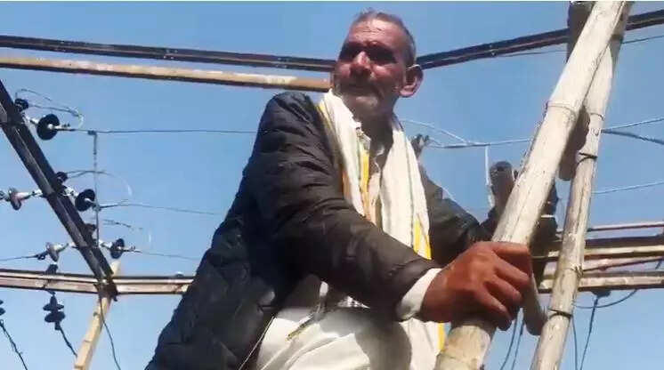 Frustrated farmer climbs high-tension pole during protest over ...