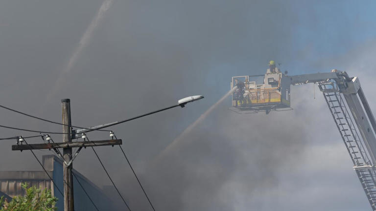 Bakery up in flames near busy train station