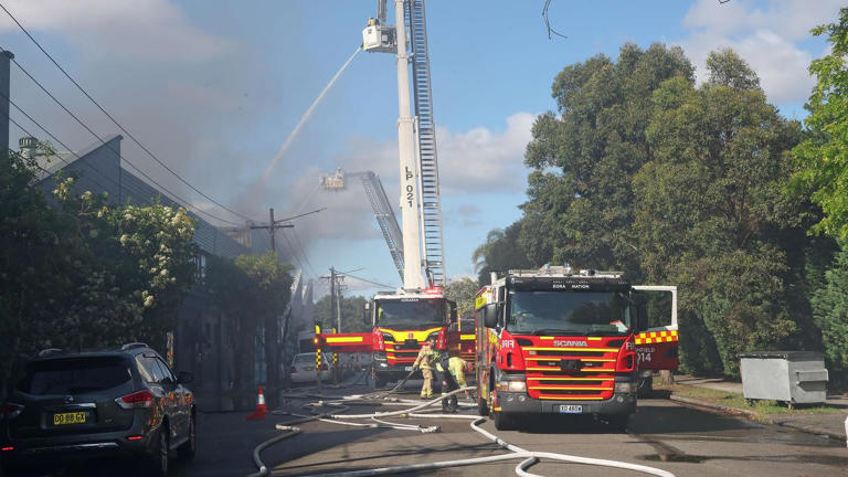 Bakery up in flames near busy train station
