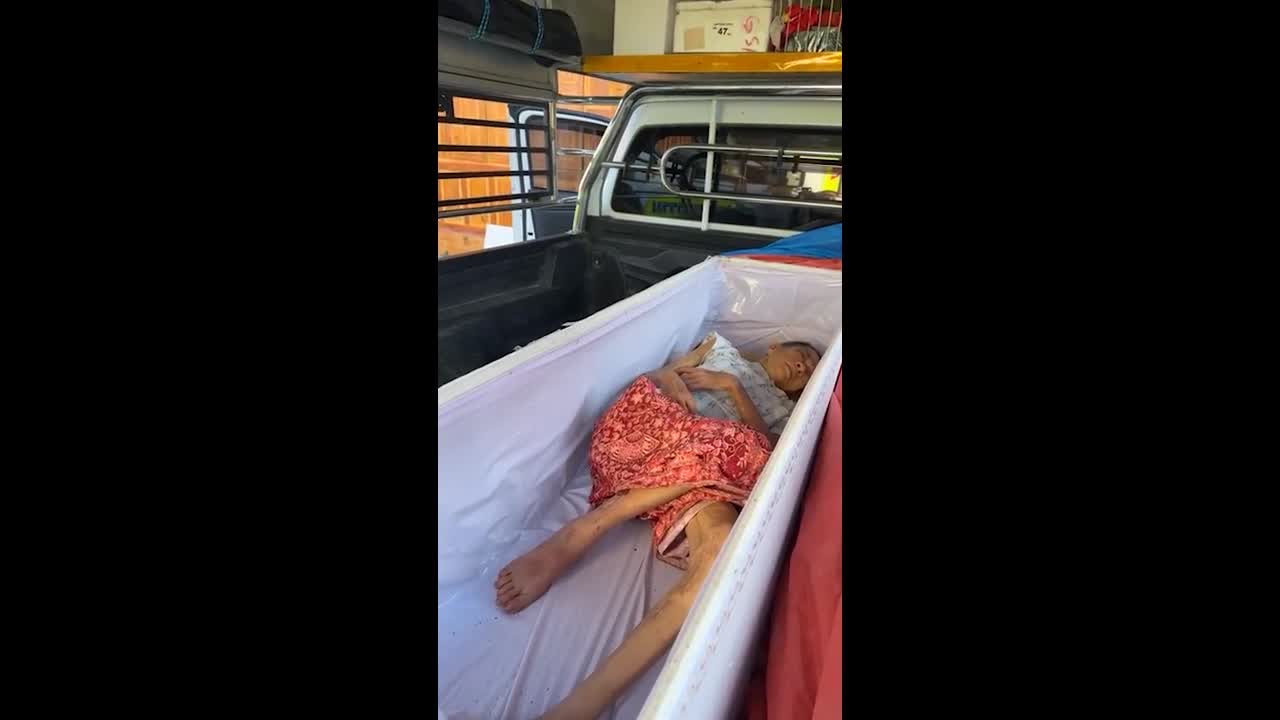 Grandmother wakes up inside coffin seconds before cremation at her own ...