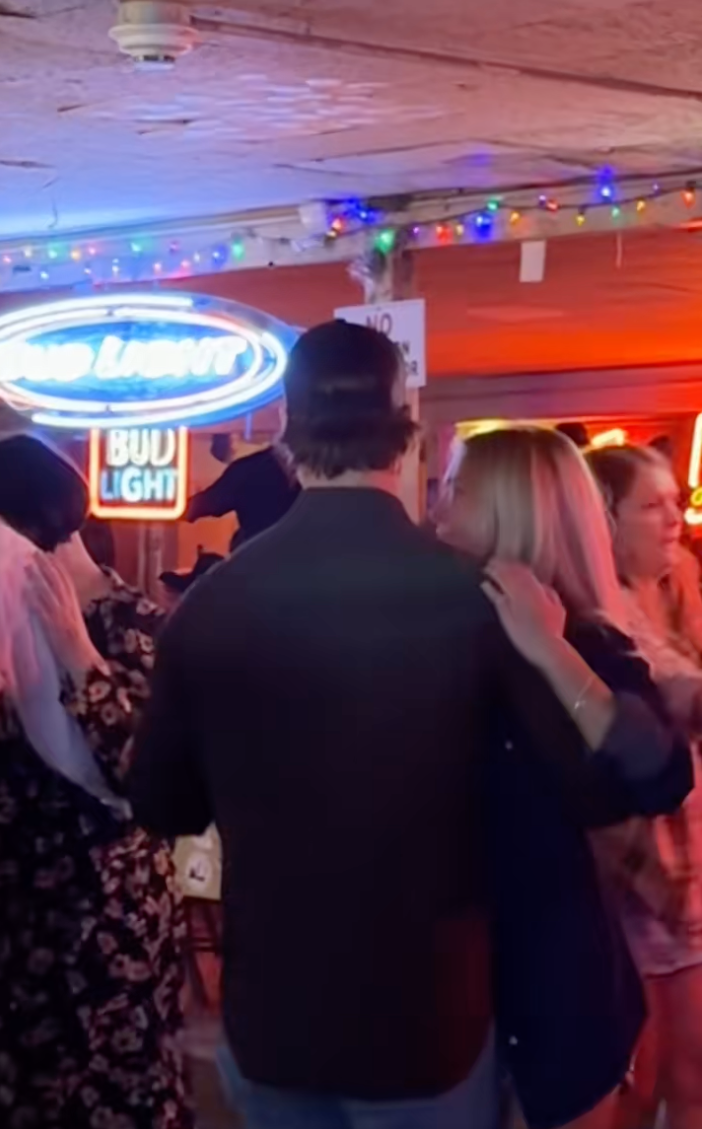 Glen Powell cozies up to actress Michelle Randolph during line dancing ...