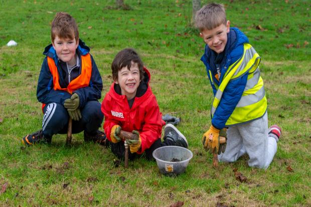 Local children plant 1,400 wildflowers to help protect pollinators